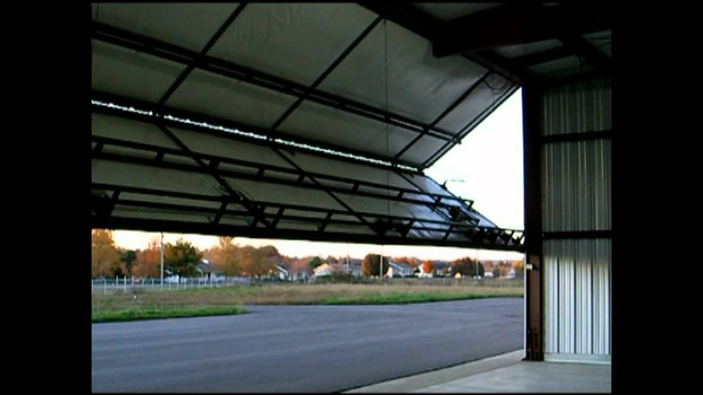 Hangar door opening - YouTube