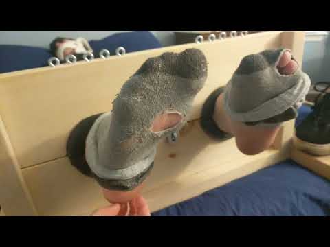 Tickling a new guy's threadbare holey-socked feet