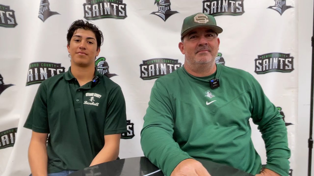 Saints baseball head coach Mike Davidson and freshman pitcher Brian ...