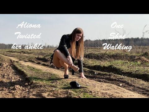 Aliona twisted ankle, girl walks in one shoe, twisted ankle girl, high heels on the field (# 1240)