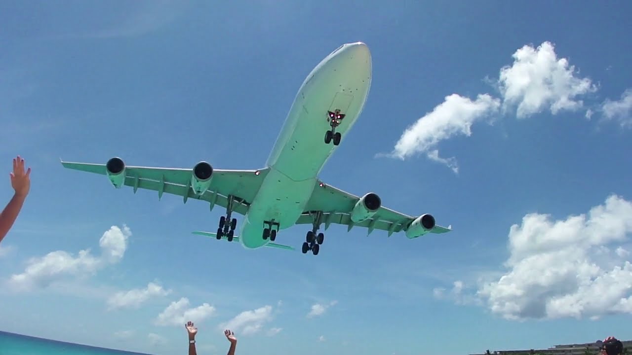 various planes landing at Princess Juliana Airport (SXM), Maho Beach ...