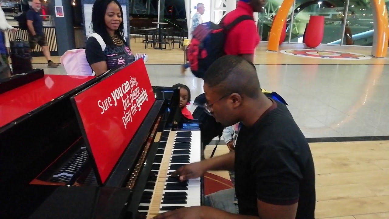 Holiday visit to Belgium Joshua playing the piano at Brussel Airport ...