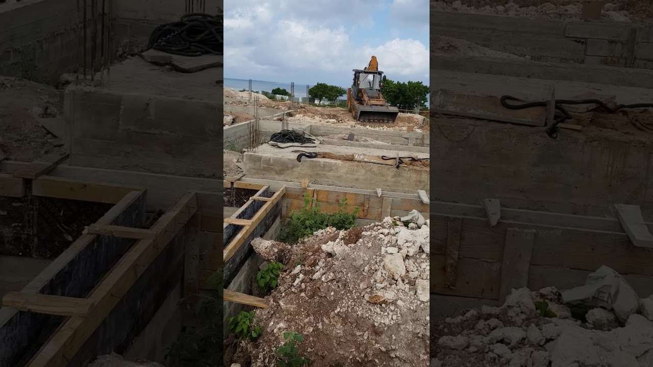 Backfilling around foundation and fill the rooms with hardcore - YouTube