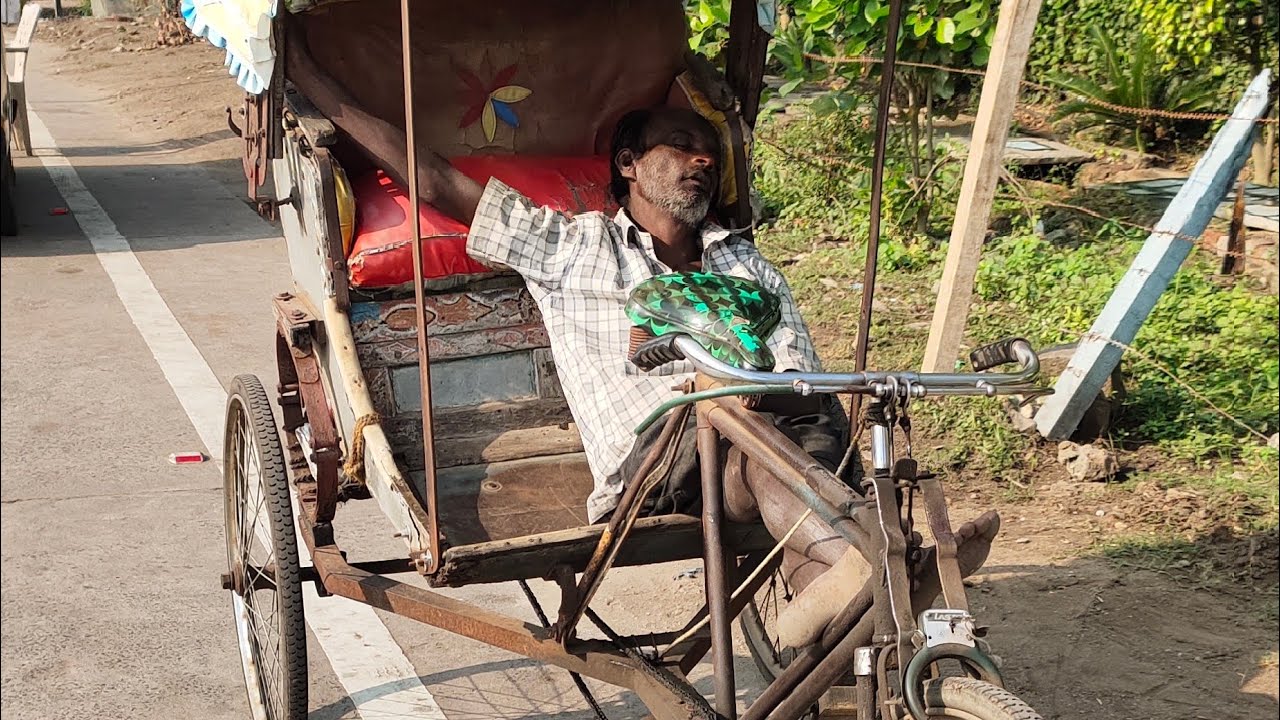 Tired Cycle Rickshaw Driver Sleeping on his Vehicle - YouTube
