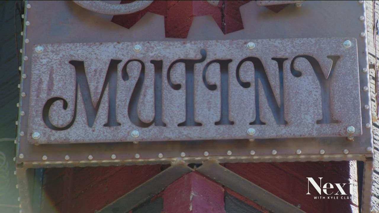 Community raises money to save Mutiny Information Cafe - YouTube
