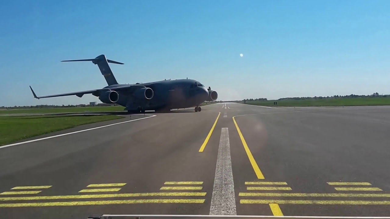 Escorting an C-17 from Ramp North to 09R on EKKA - YouTube