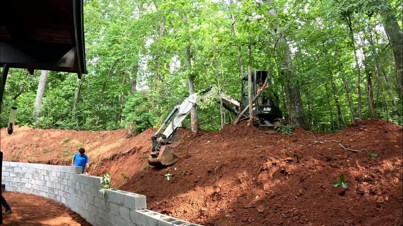 Backfilling and Hauling for a Stunning Retaining Wall - YouTube