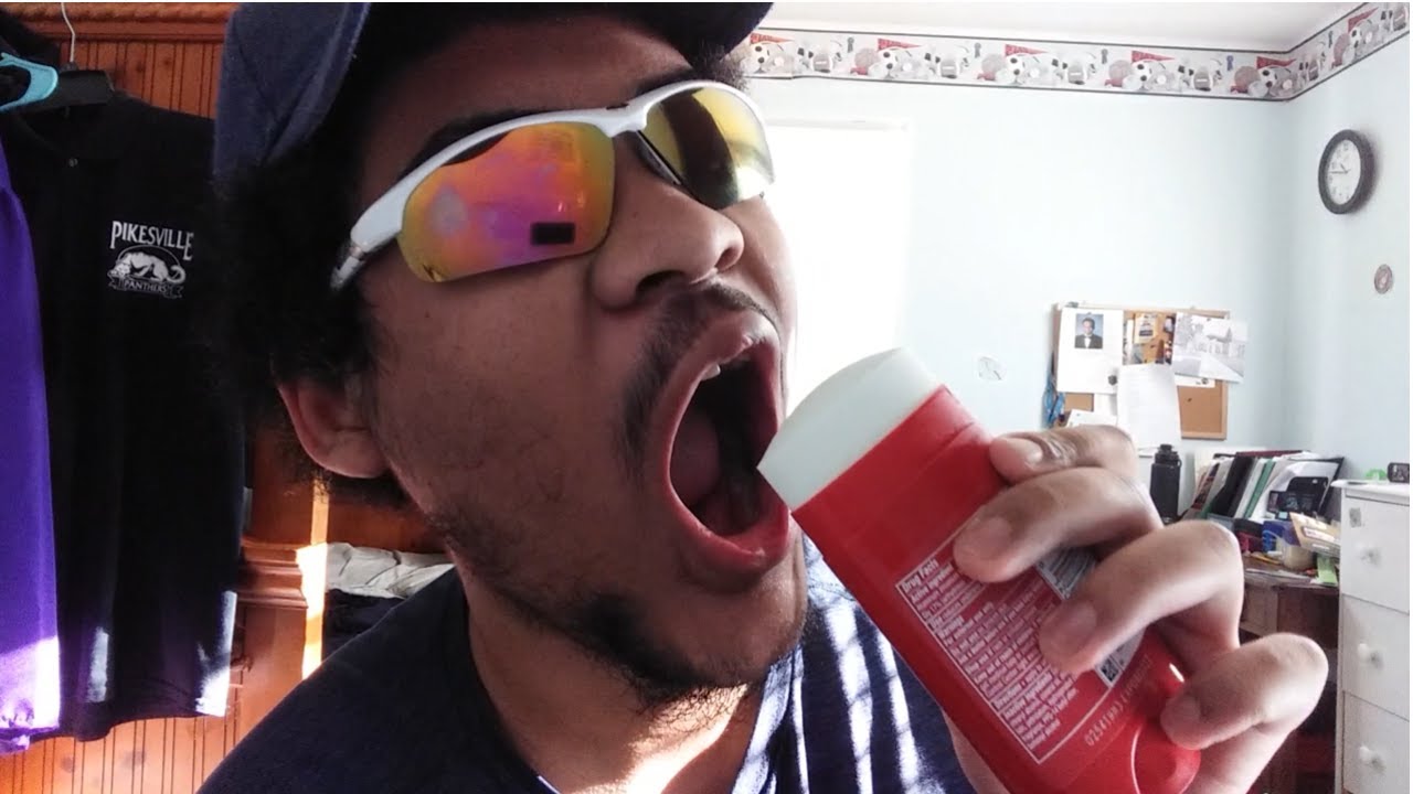taking a big bite of old spice deodorant (do not try this at home ...