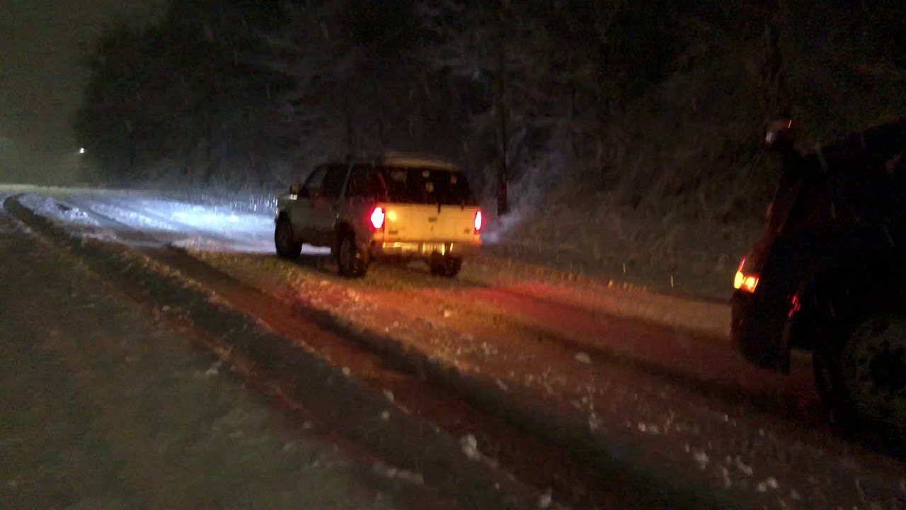 1992 Ford Explorer pulling 18 wheeler uphill in the snow - YouTube