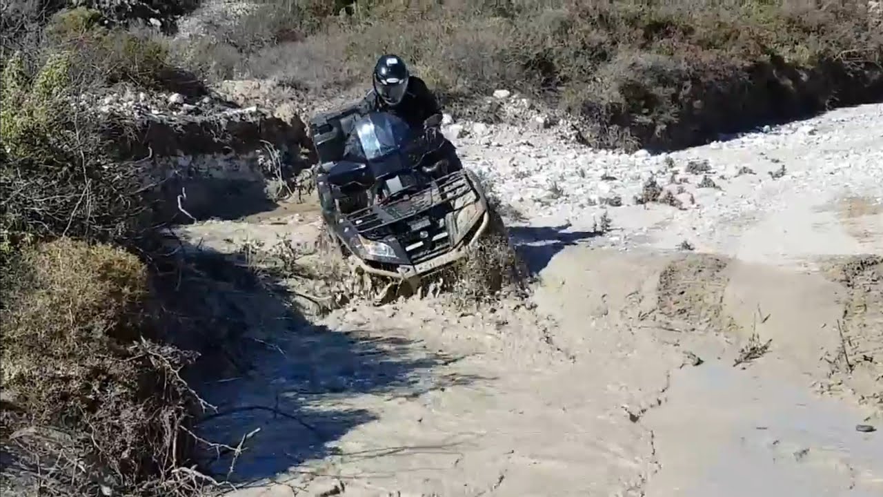 ATV STUCK IN DEEP MUD HOLE - YouTube