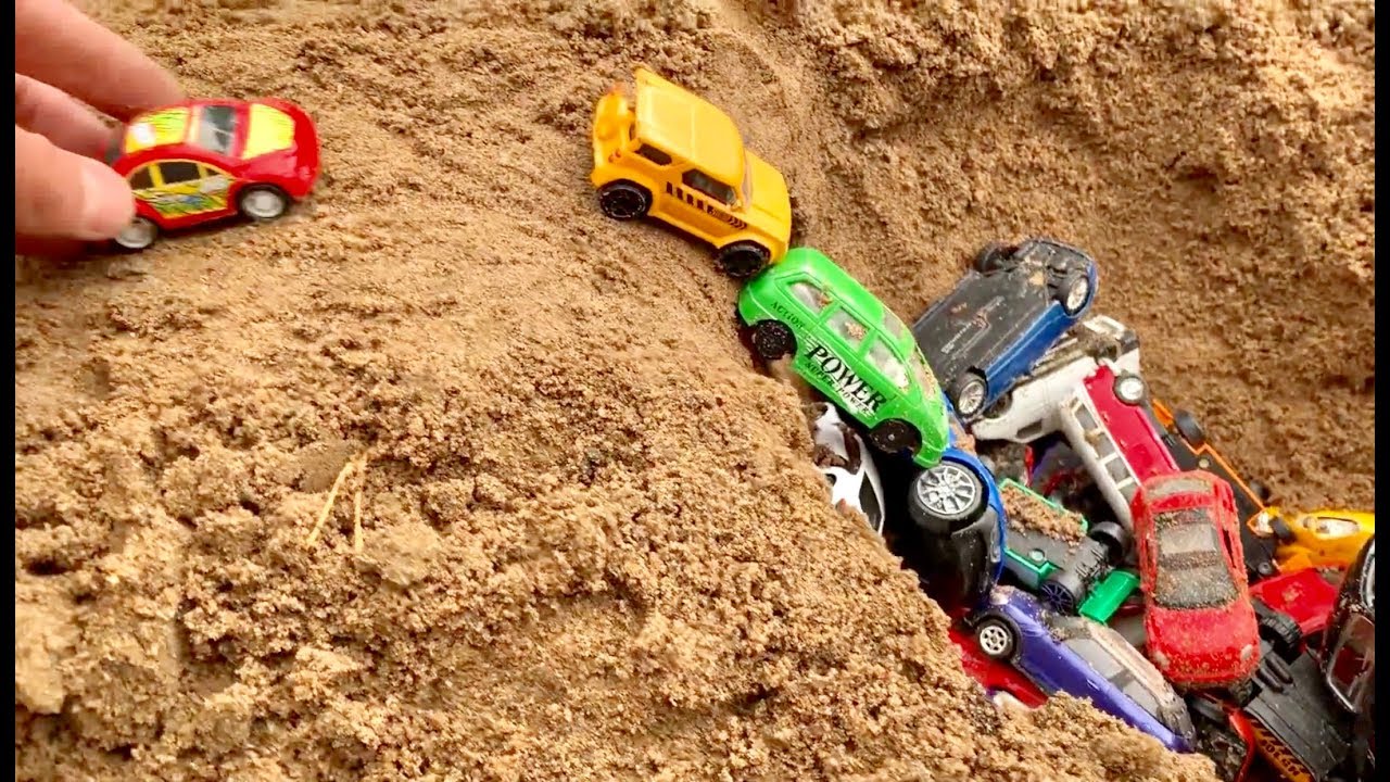 Playing with cars in sand - YouTube