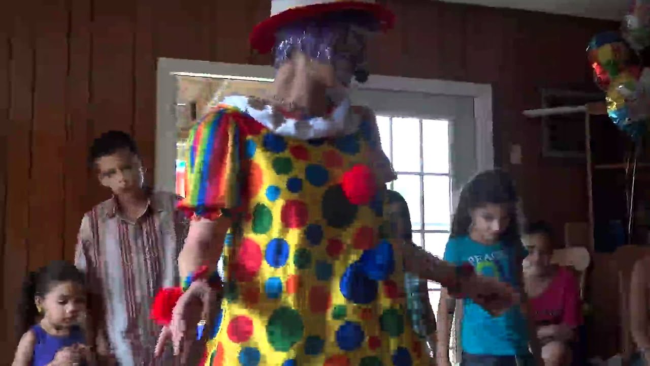Lulu Clown playing with kids party rentals on Four J Bouncer - YouTube