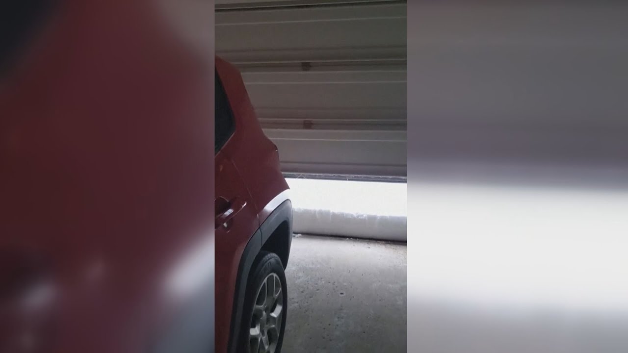 VIDEO | Buffalo resident opens garage door to several feet of snow ...