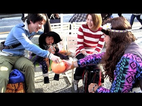 Cute crying little Japanese girl in Halloween witches costume Ginza Street Tokyo on Sunday afternoon