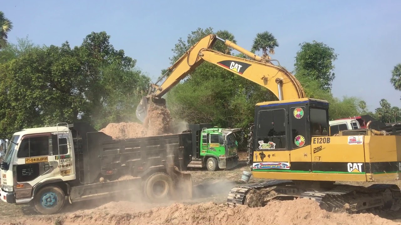 Excavator loading to the truck - YouTube
