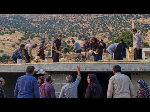 The villagers help Mr. Dal build a brick parapet around her roof.
