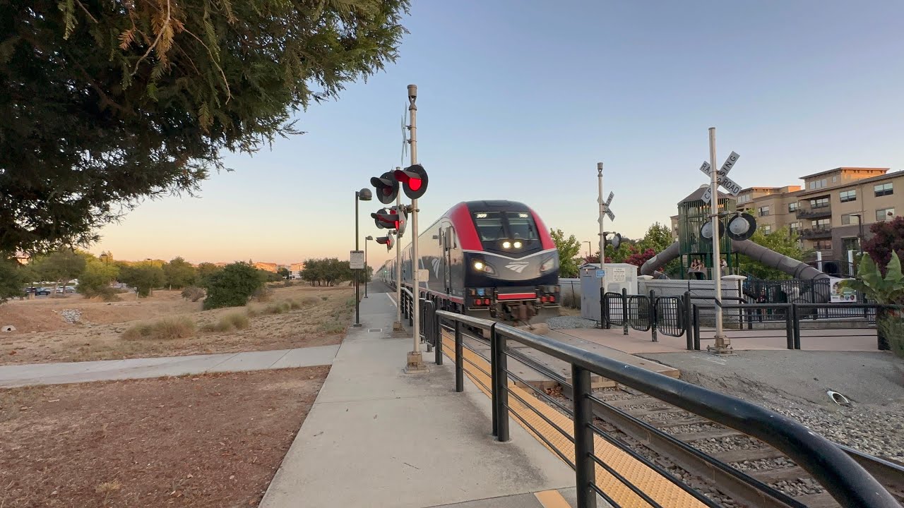 Late Amtrak Coast Starlight passes Morgan Hill Caltrain Station w/ a ...