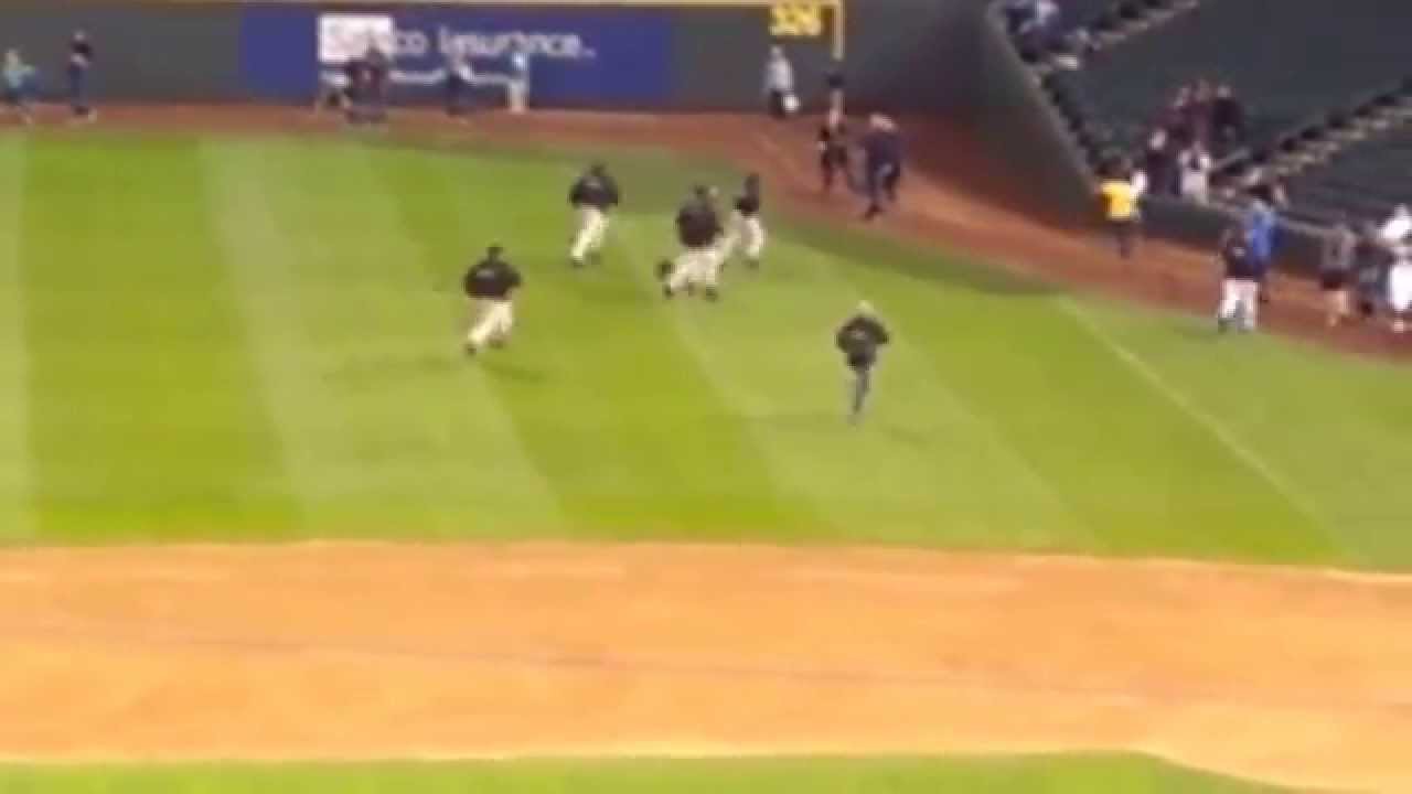 Seattle Mariners fan runs on the field opening day - YouTube