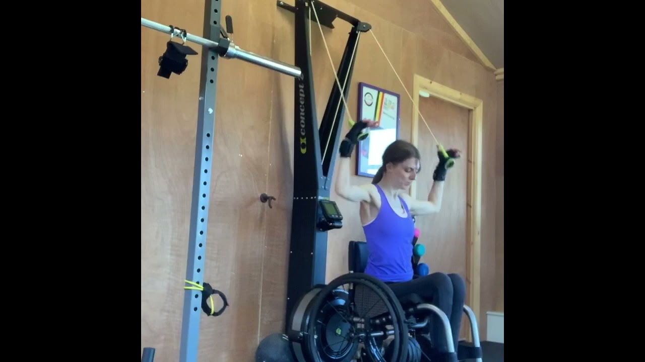 Natalie uses the ski erg with the looped aids | Disability Workout ...