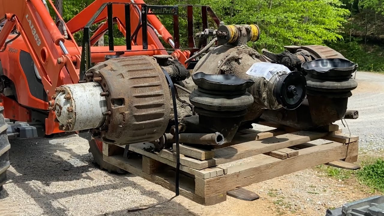 Putting a new rear axle in a vintage mci bus mc7 - YouTube