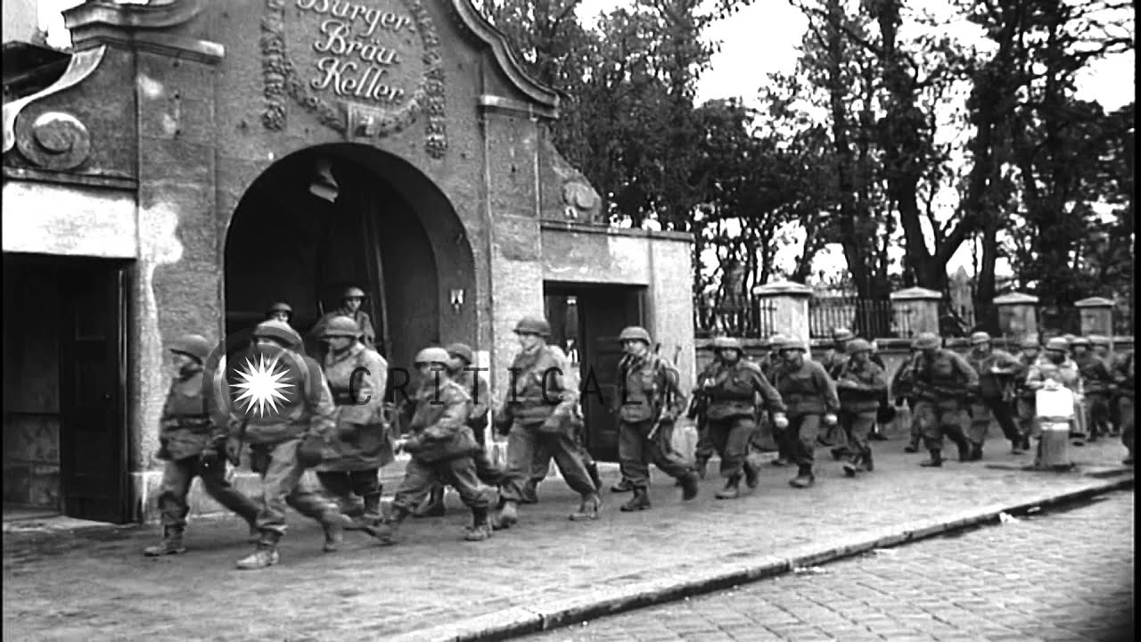 US Army soldiers of 42nd (Rainbow) Division march past Burger-Brau ...