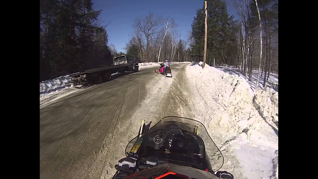 car on snowmobile trail - YouTube