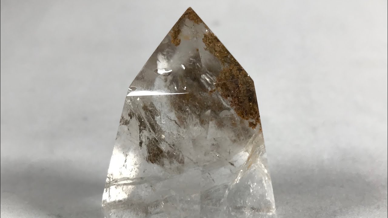 Quartz point with unique occlusions - YouTube