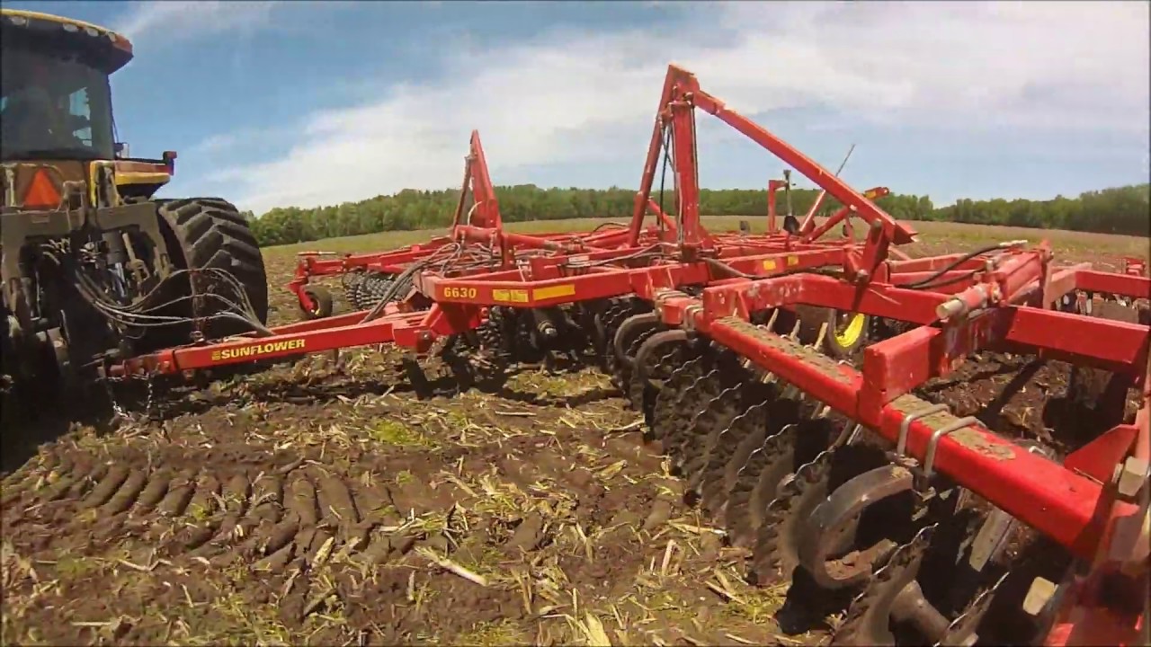 Challenger MT765 with sunflower vertical tillage tool - YouTube