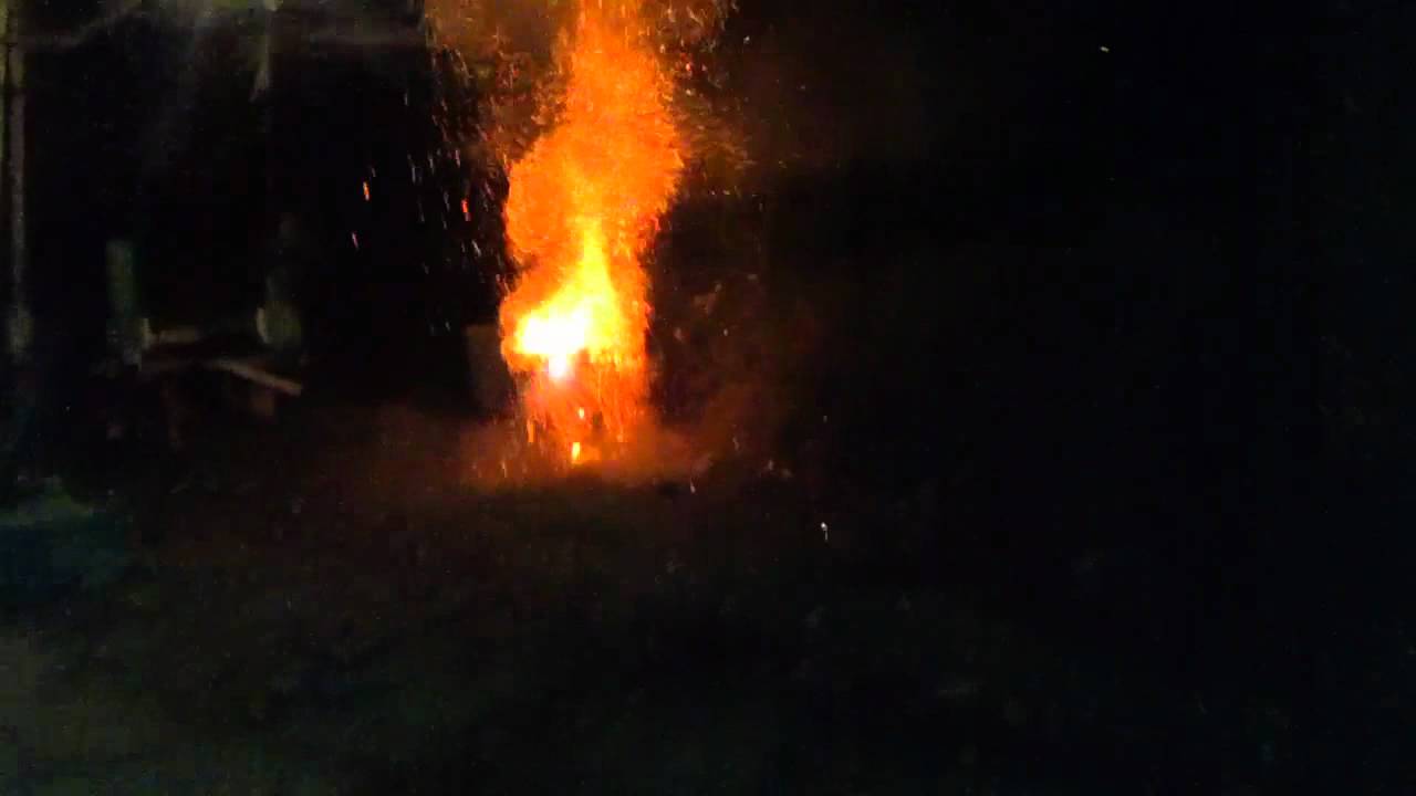 Firework blows up in a flaming trash can - YouTube