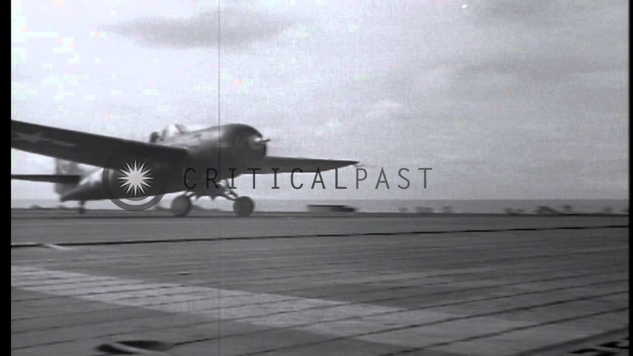 Formation of US Navy TBF Avenger torpedo planes over escort aircraft ...