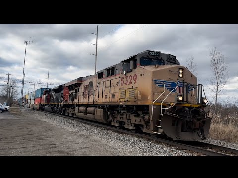 UP 5329 leads CN Q116 through Linden, Mi - YouTube