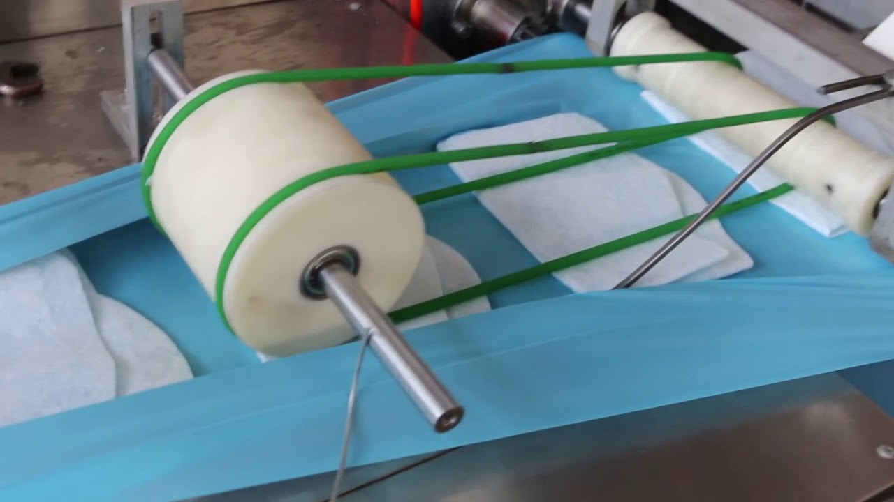 Disposable Baby Dribble Bib Machine - YouTube