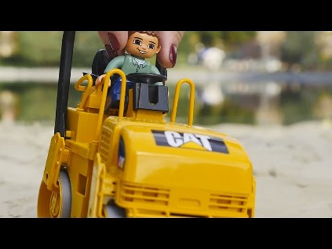 Çizgi film - Plajda oyuncak silindir kum eziyor. Günün sorusu CAT anlamı nedir?