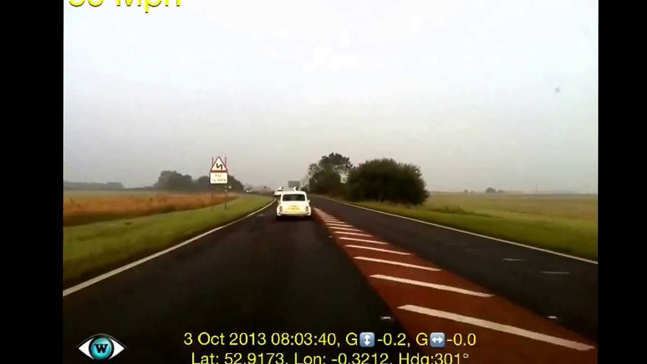 Fast Mini overtakes in stupid place two side roads and over cross hatch ...