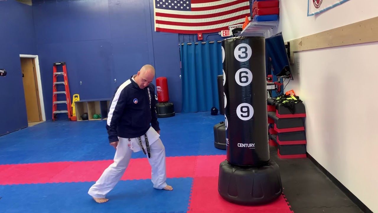Practicing reverse punch on a bag - YouTube