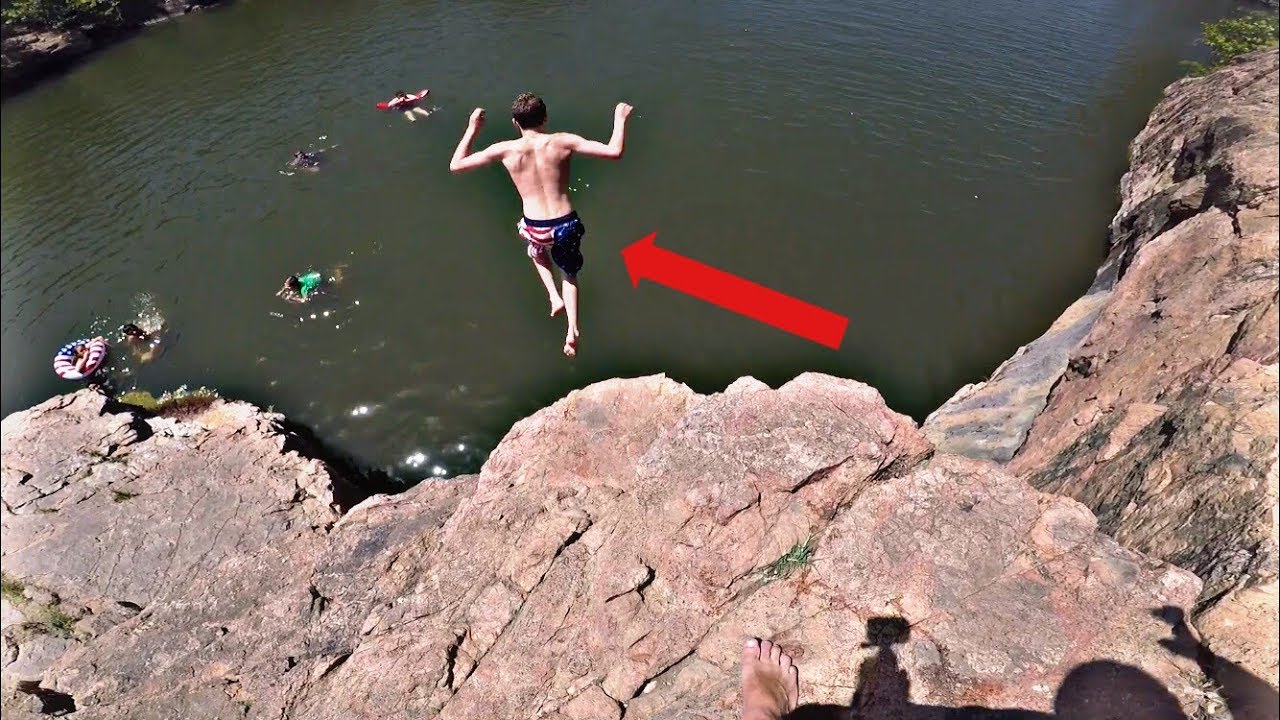 INSANE CLIFF JUMPING AT DEVILS WATERHOLE!! - YouTube