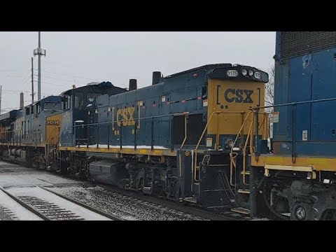 big CSX freight train with a mp15 DC switcher unit and a gp38 six engines - YouTube