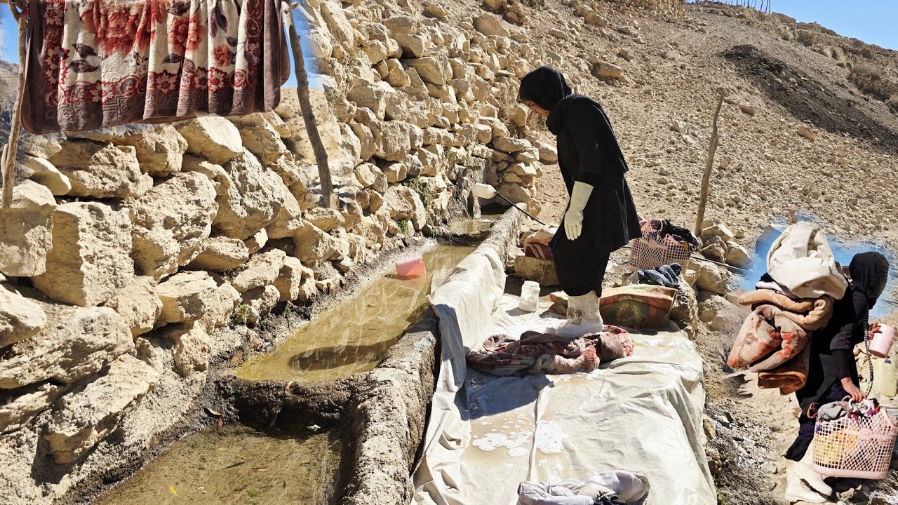 The hardships of nomadic life: washing clothes in pristine nature and ...