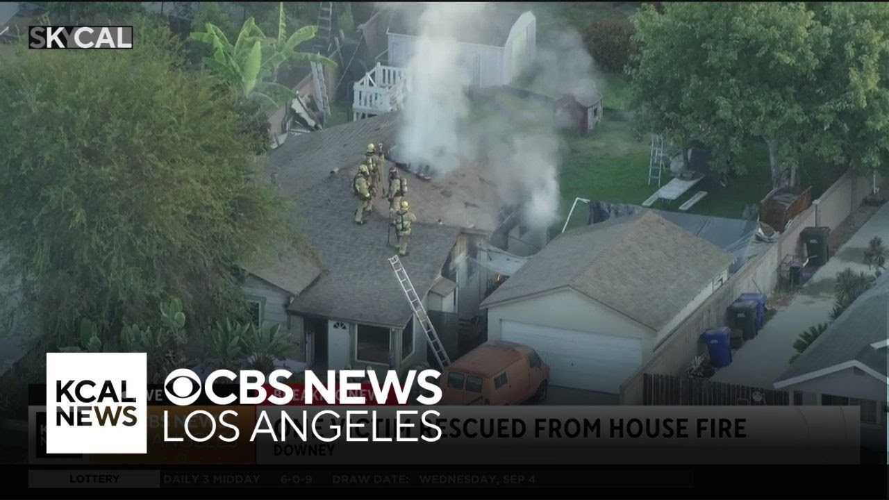Downey firefighters rescue one person trapped in a house fire - YouTube