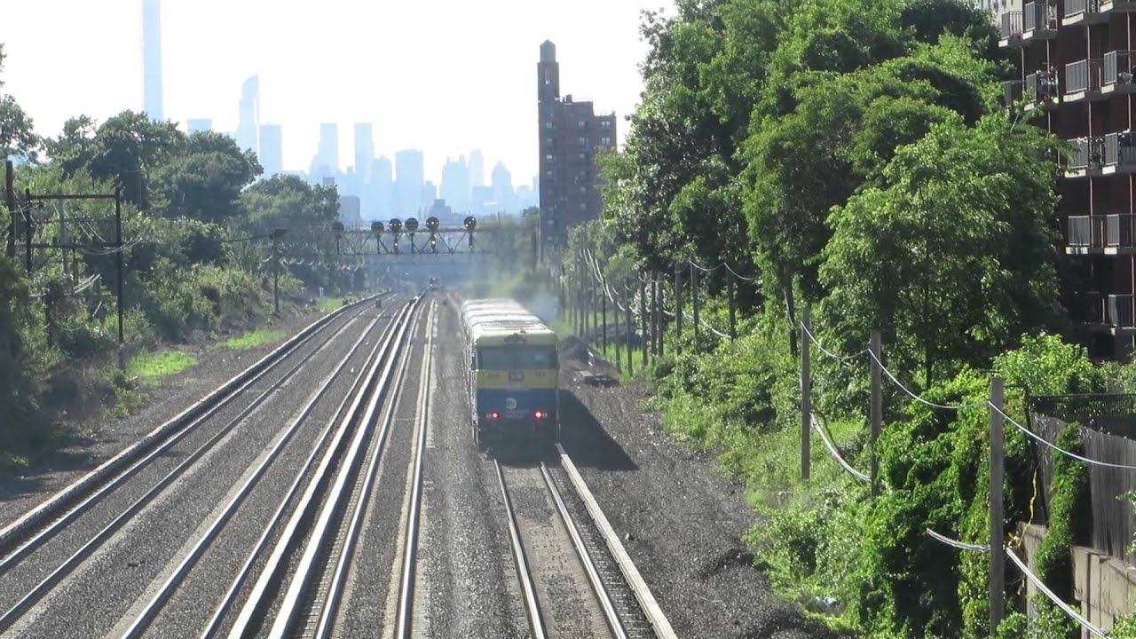 LIRR Main Line: Westbound DM30AC 502 and C3s passing 67 Av Overpass ...