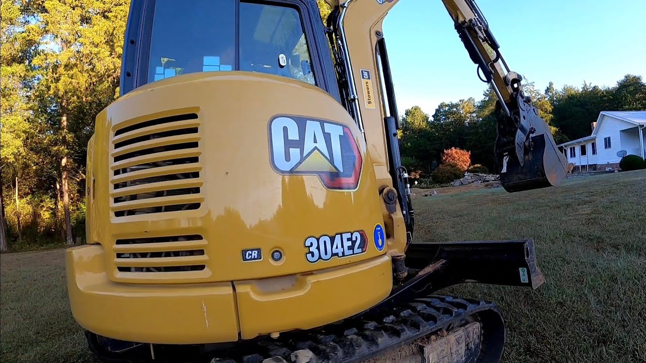 VERTI-BLOCK RETAINING WALL FOOTERS. CAT 304 CAT 259 - YouTube