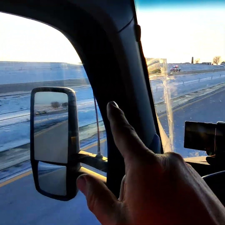 Trucker Is Driving In The Fast Lane Speeding While Holding A Camera 