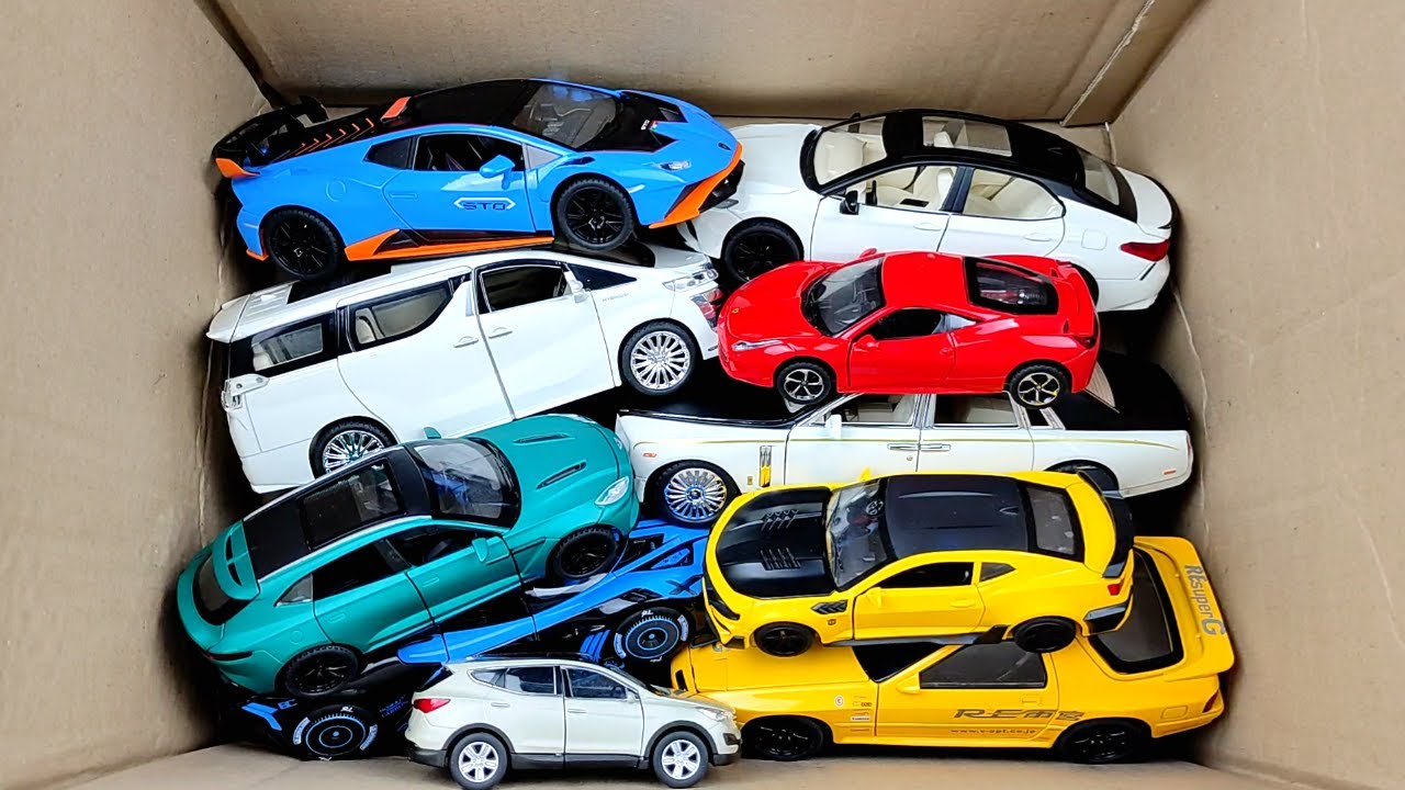 Box Full of Model Cars Mazda RX7, Rolls Royce Phantom, Bugatti ...