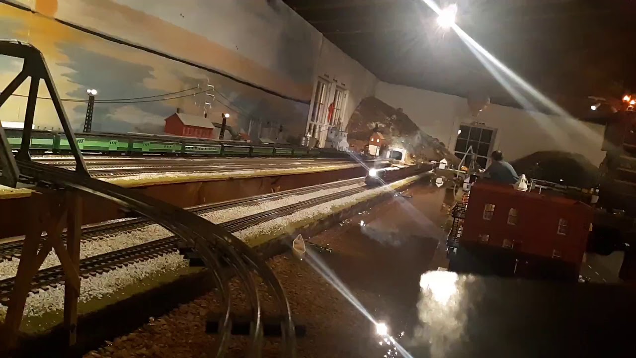 MTH Pennsylvania Trainmaster pulling train by the river. - YouTube