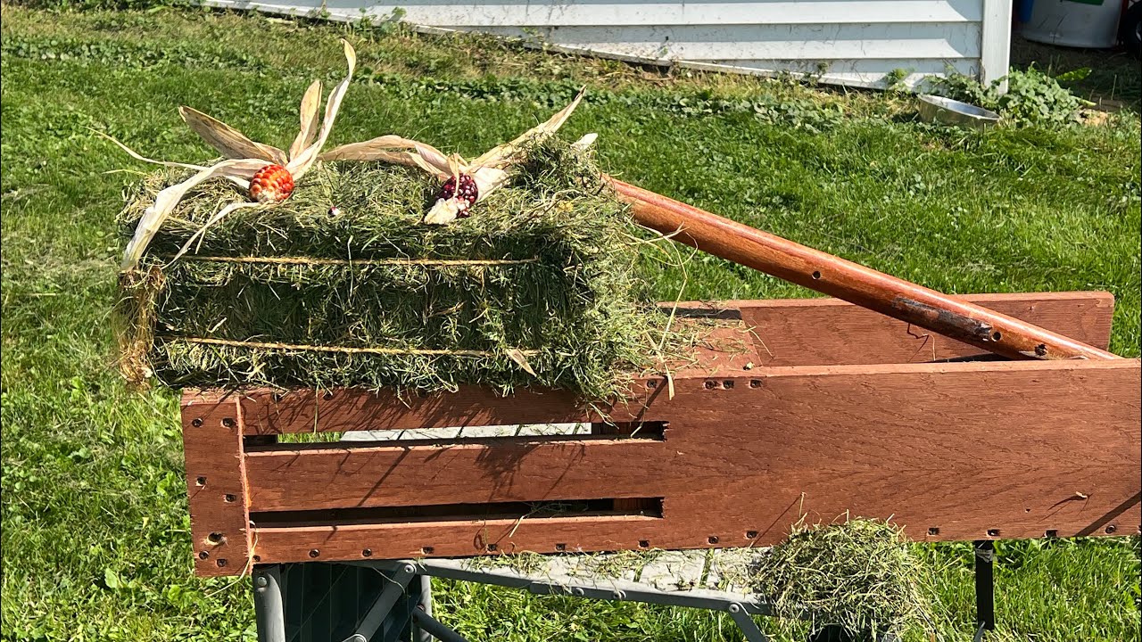 Making a decorative hay bale with a mini hay baler by hand - YouTube