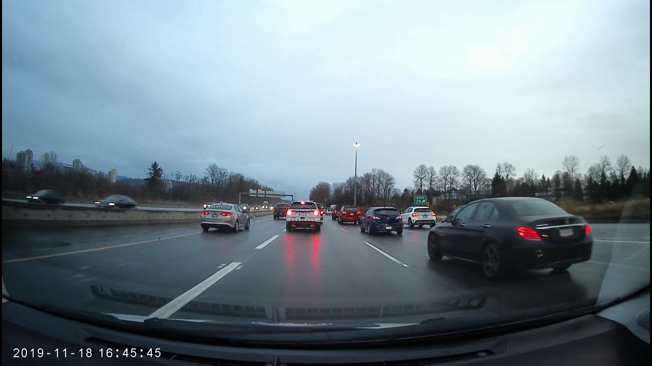 cop on his phone almost hits car - YouTube