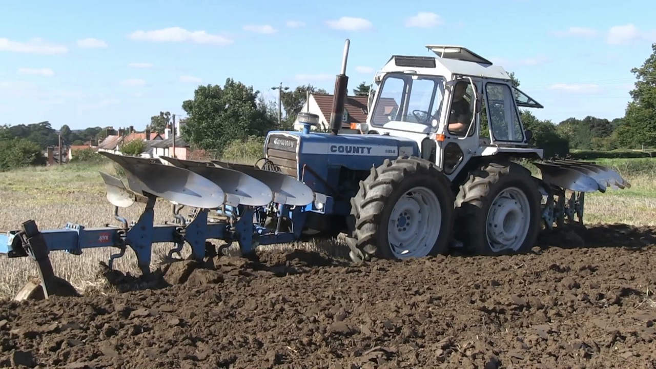TWO COUNTY 1184TW AND PUSH-PULL PLOUGHS - YouTube