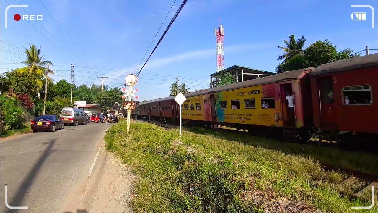 Puttalam - Mount Lavinia Express Train near Peralanda Railway crossing ...