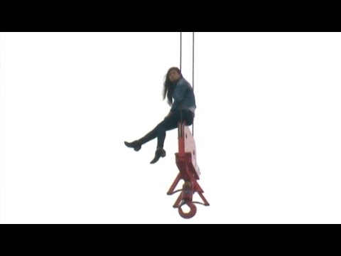 Woman gets stuck on top of crane - YouTube
