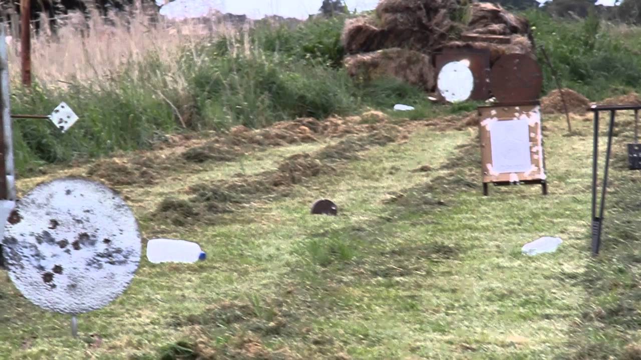 Shooting a 2.5 inch steel plate with a variety of rifles - YouTube